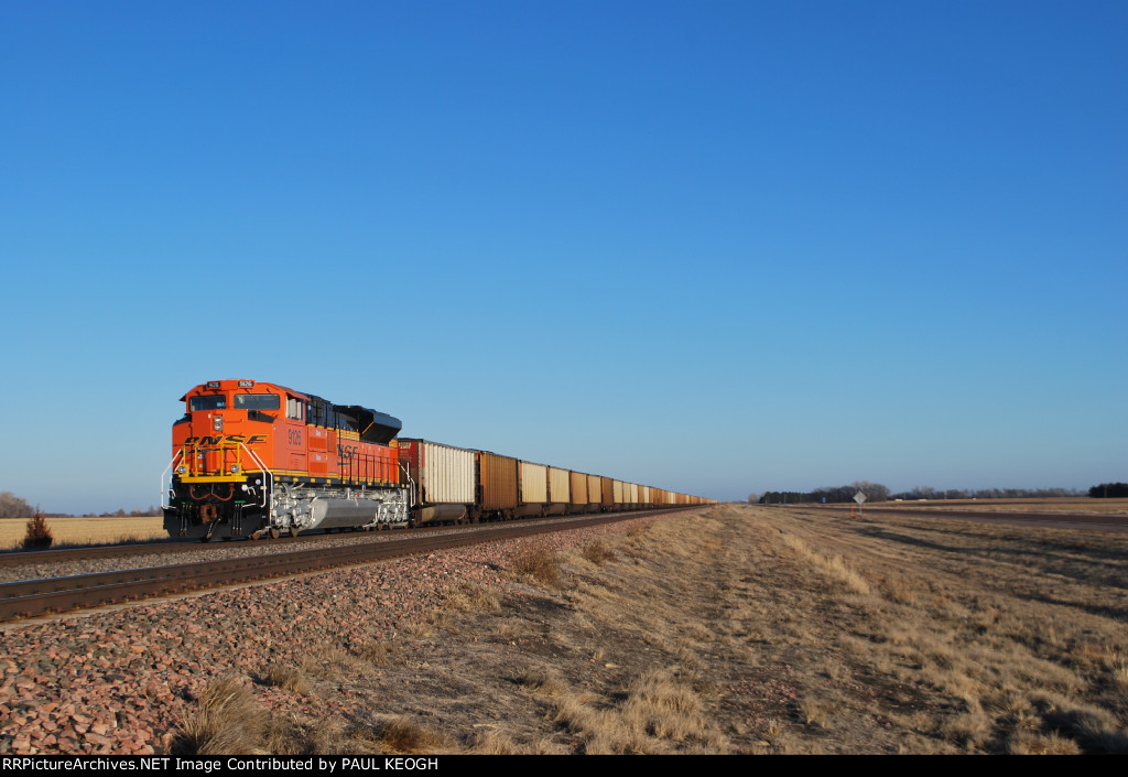 The Sun Sets on BNSF 9126 as the Coal Train stretches out in front of Her. You Can Barely See ...